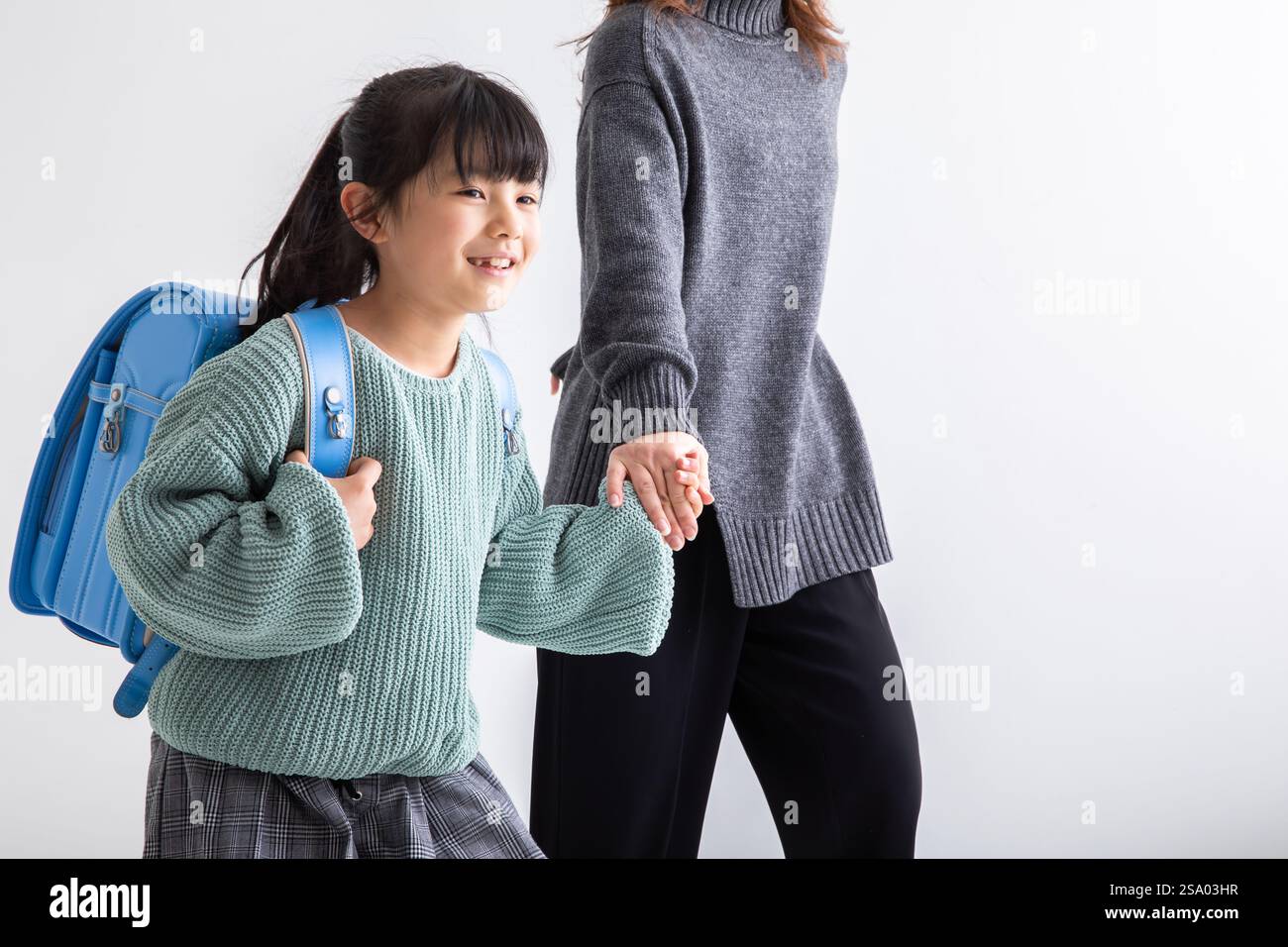 Primary school children walking hand in hand Stock Photo - Alamy