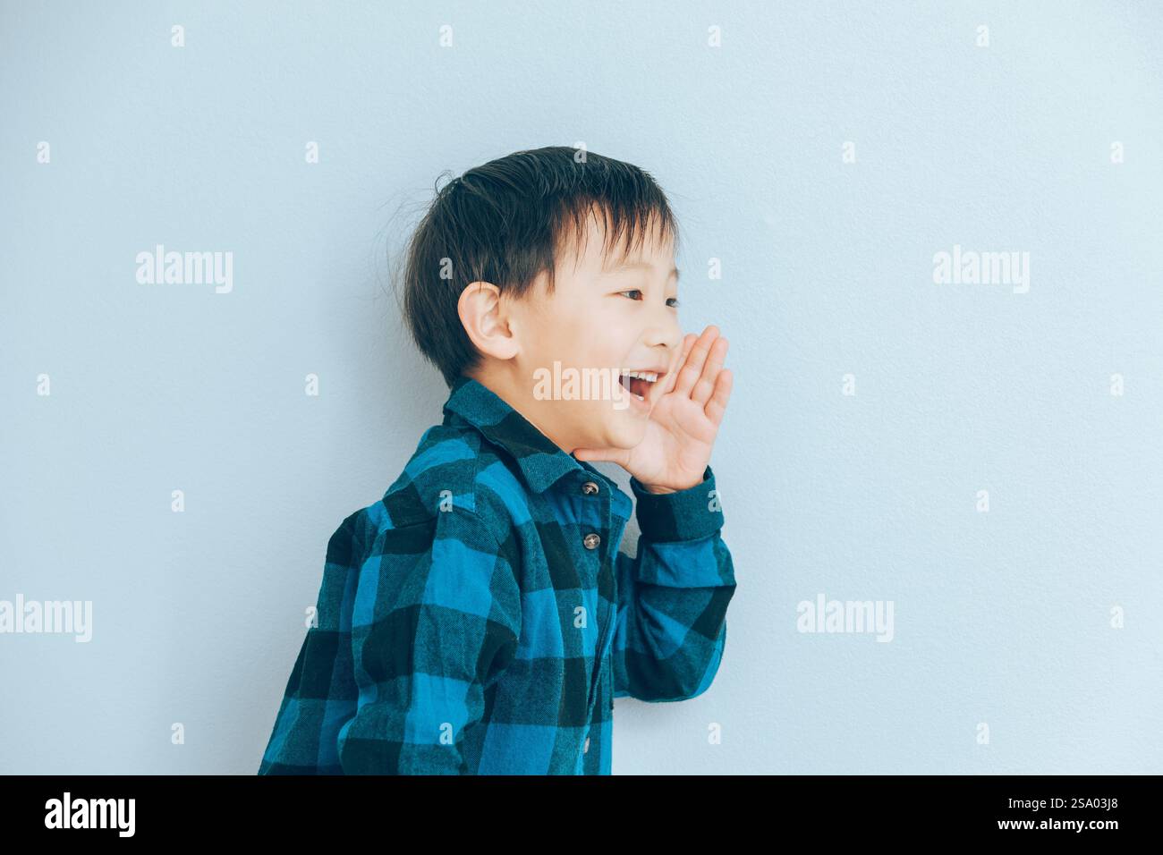 Child striking a shouting pose Stock Photo - Alamy