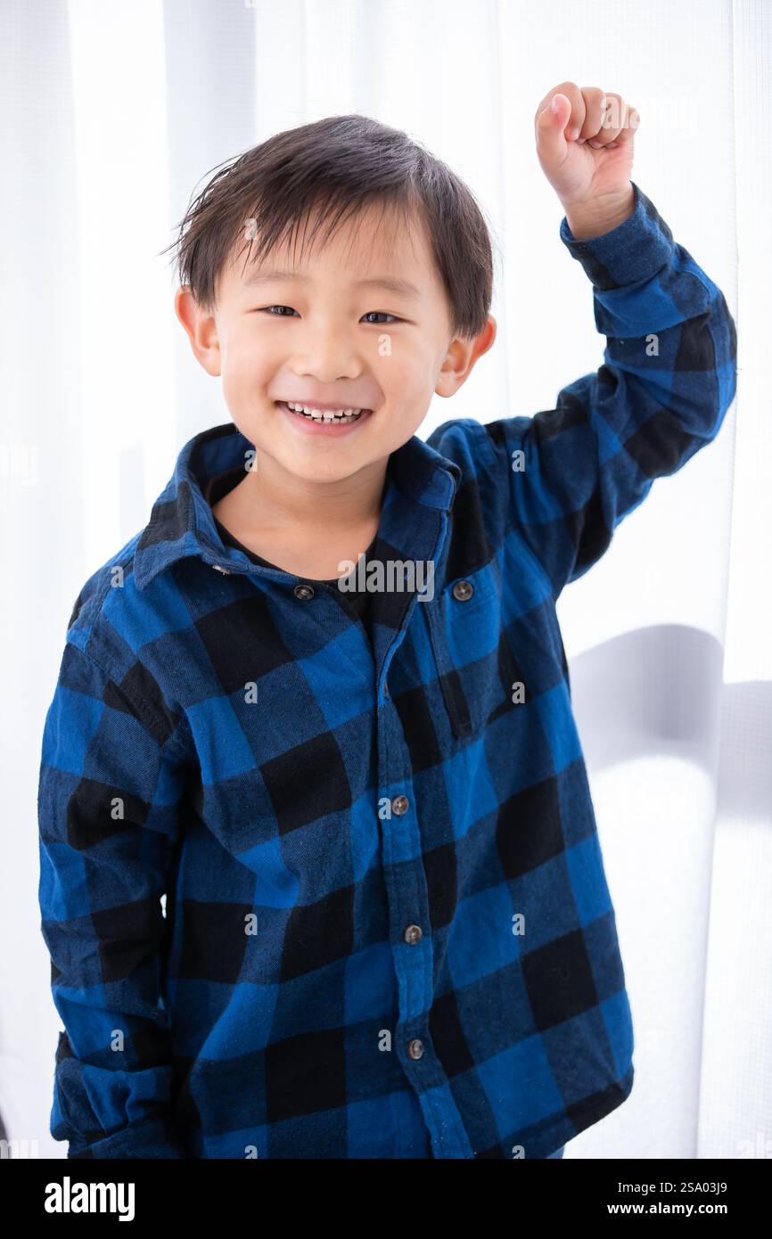 Small boy posing with his guts Stock Photo - Alamy