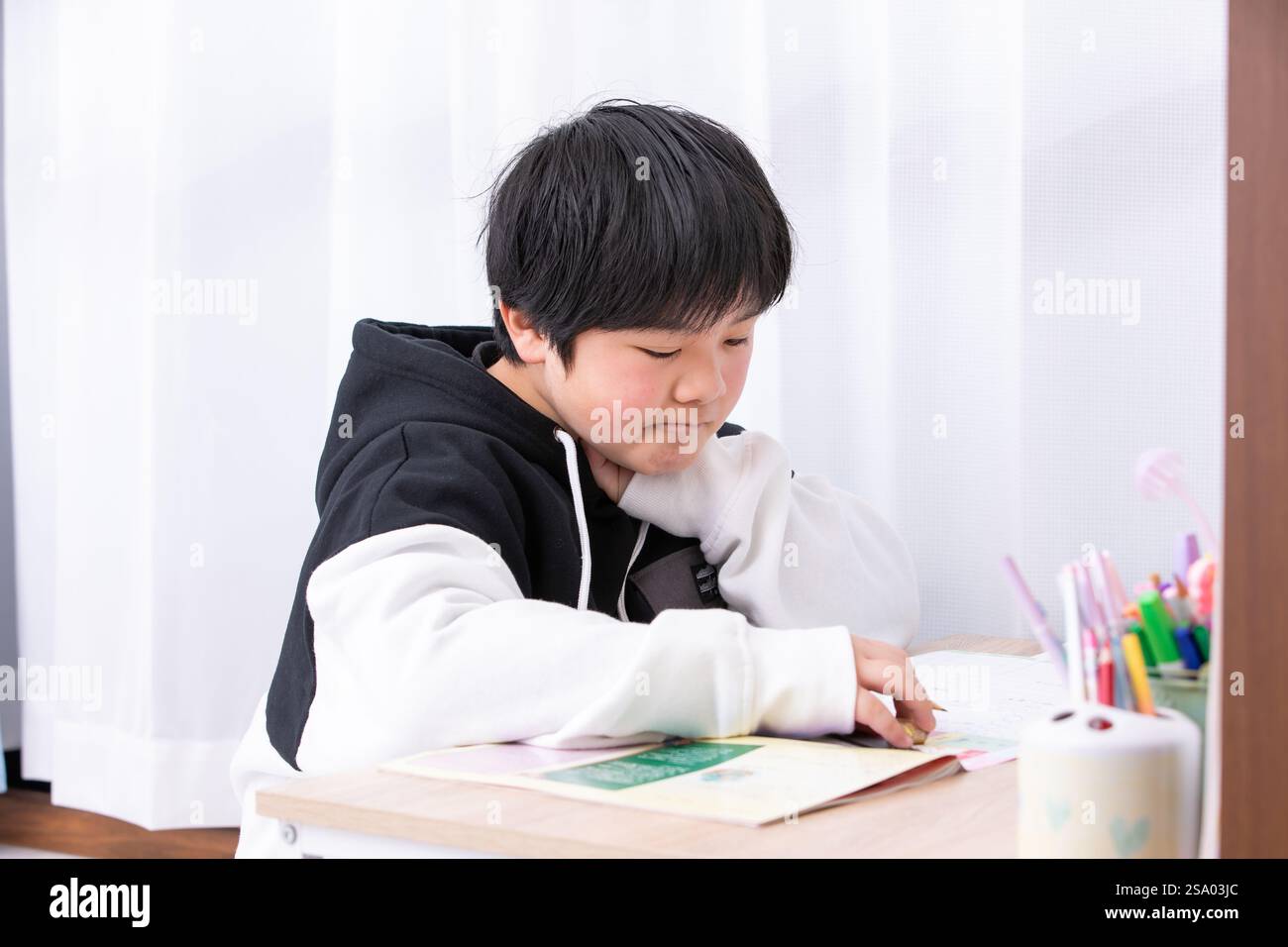 Primary schools student studying for an exam Stock Photo - Alamy