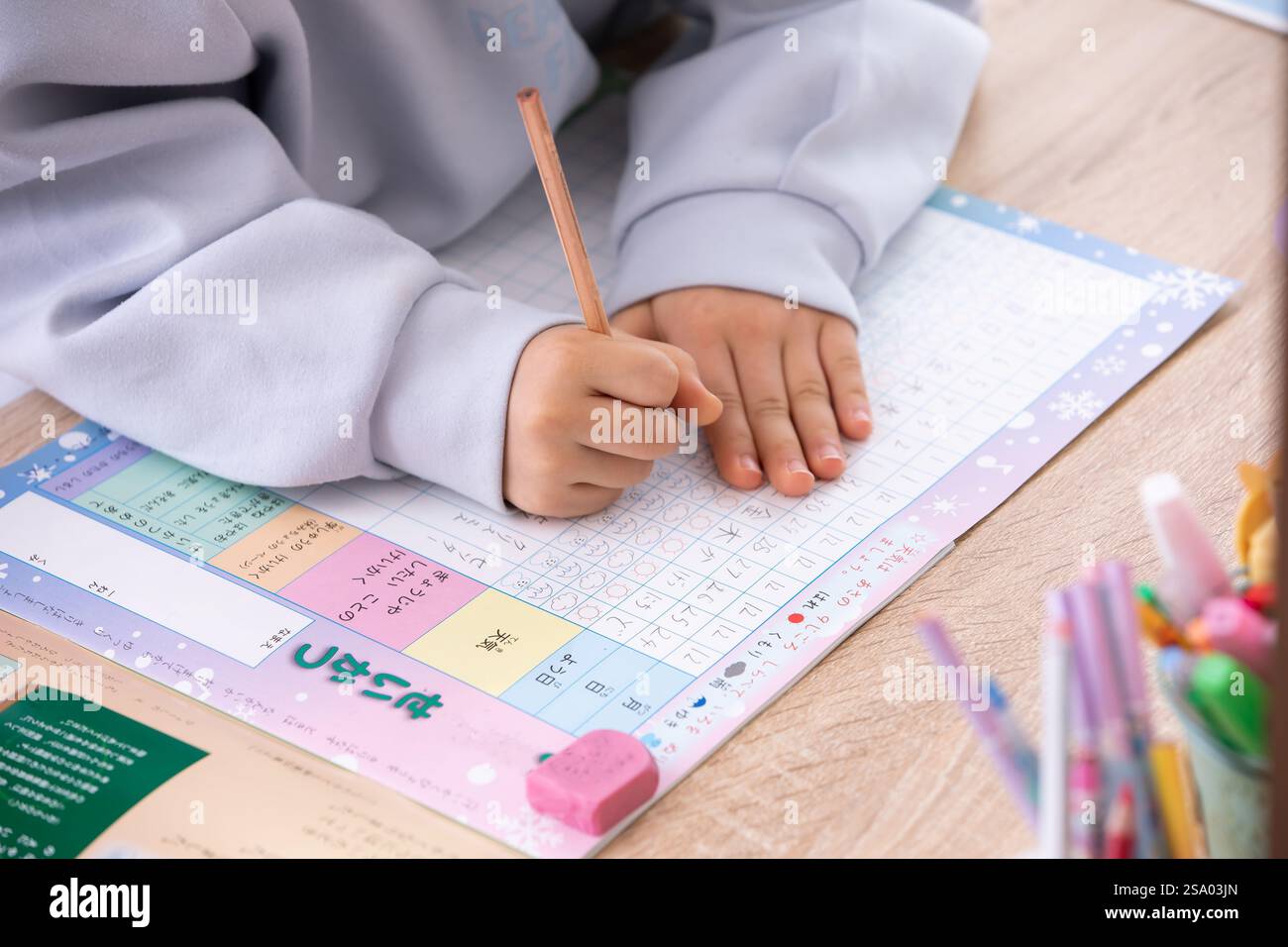Child writing a notebook Stock Photo - Alamy