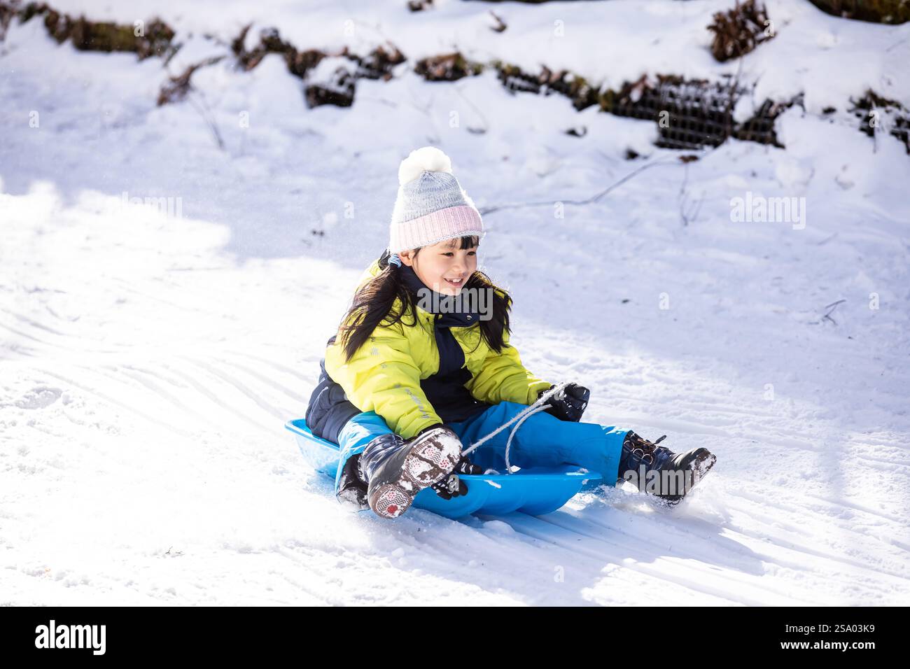 Kids playing on snowy area hi-res stock photography and images - Alamy