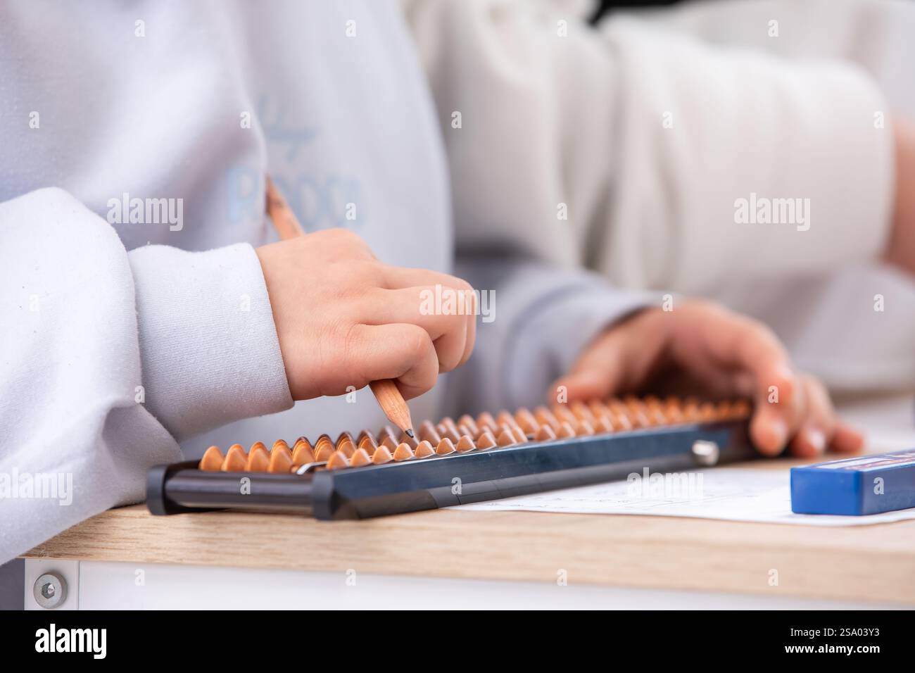 Child's hand on the abacus Stock Photo - Alamy