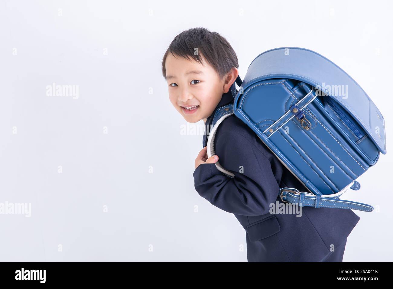 Child carrying heavy school bag hi-res stock photography and images - Alamy