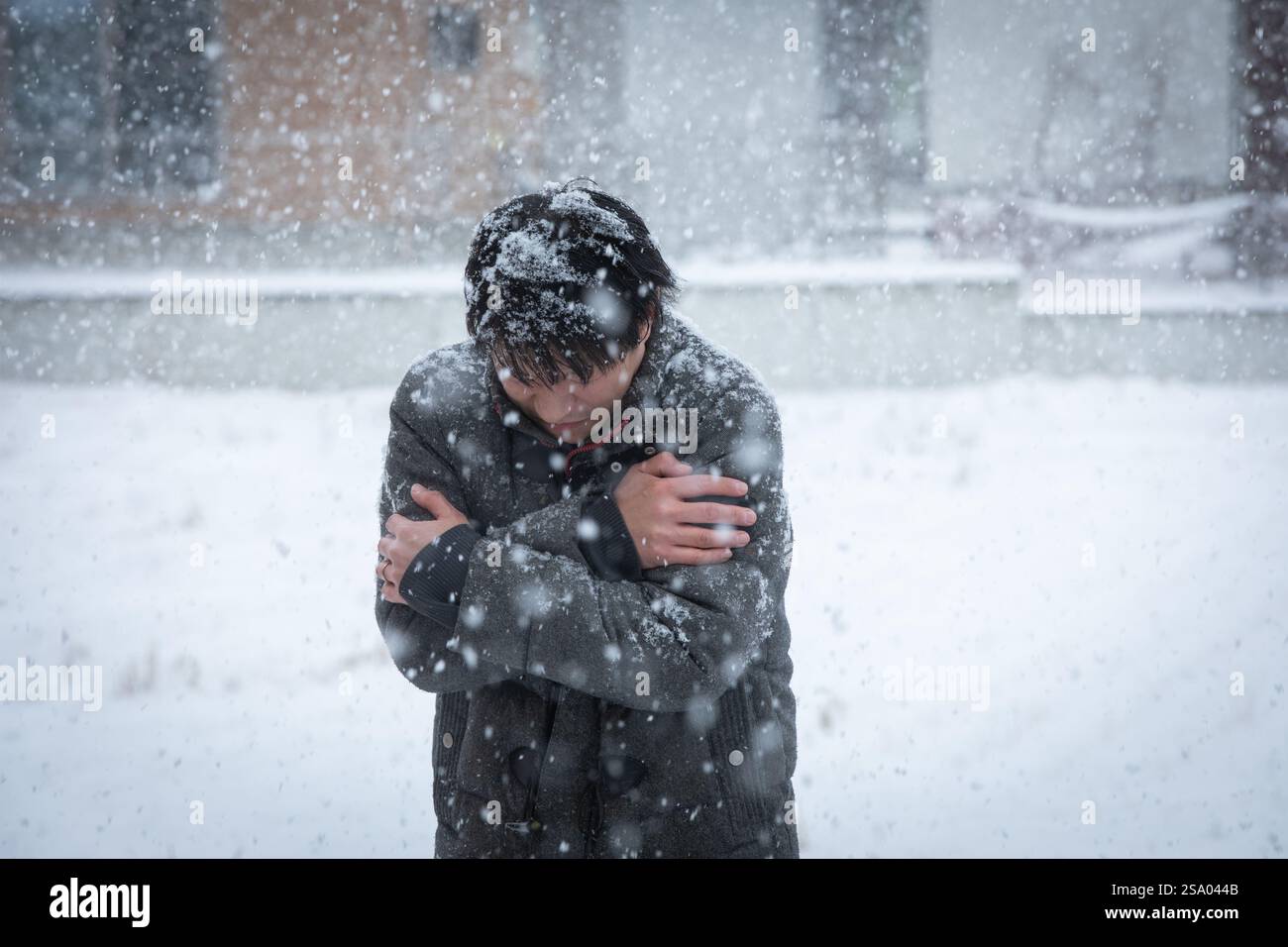 Man freezing in the snow Stock Photo - Alamy