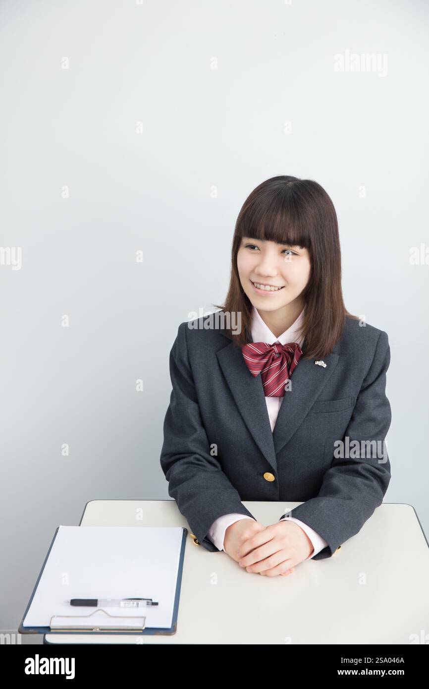 Female high school students taking a class Stock Photo - Alamy