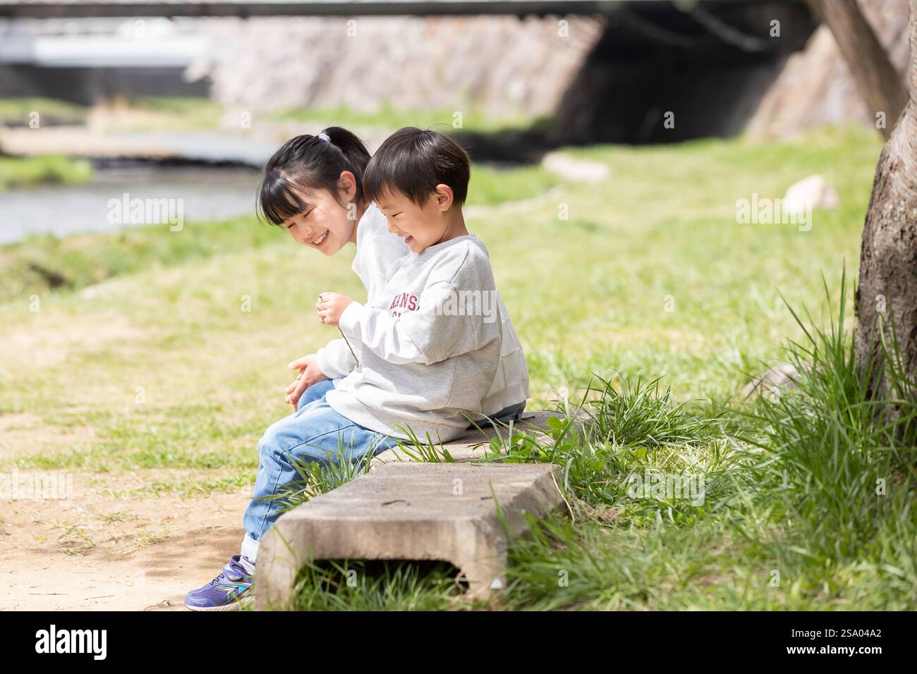 Schoolboy sitting on park bench hi-res stock photography and images - Alamy