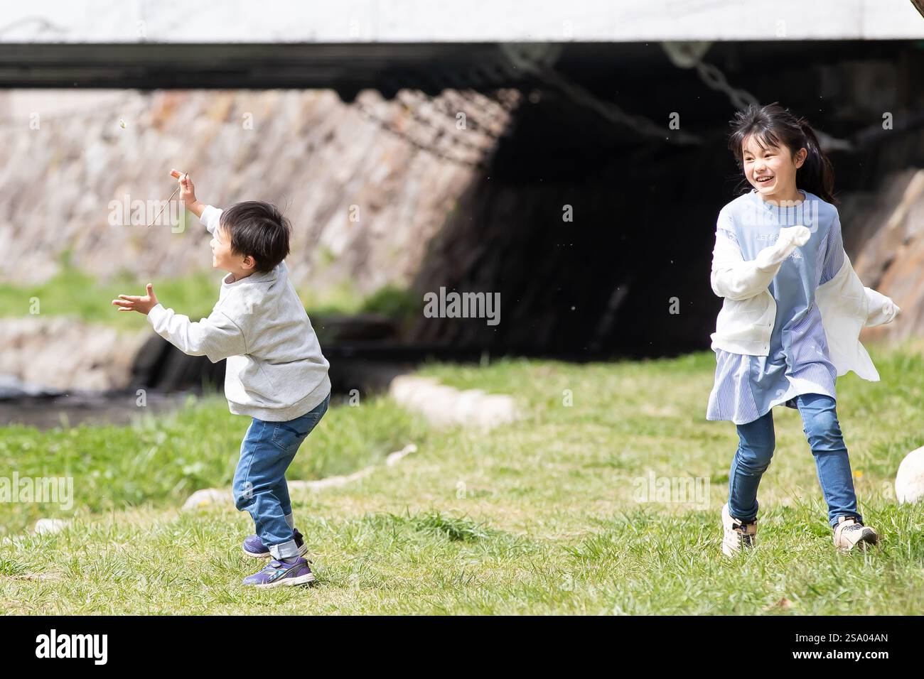 Smiling children playing in park Smile Stock Photo - Alamy