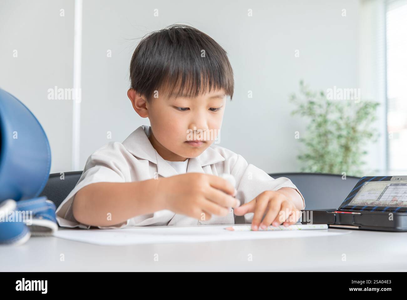 Primary schools boy taking a class Stock Photo - Alamy