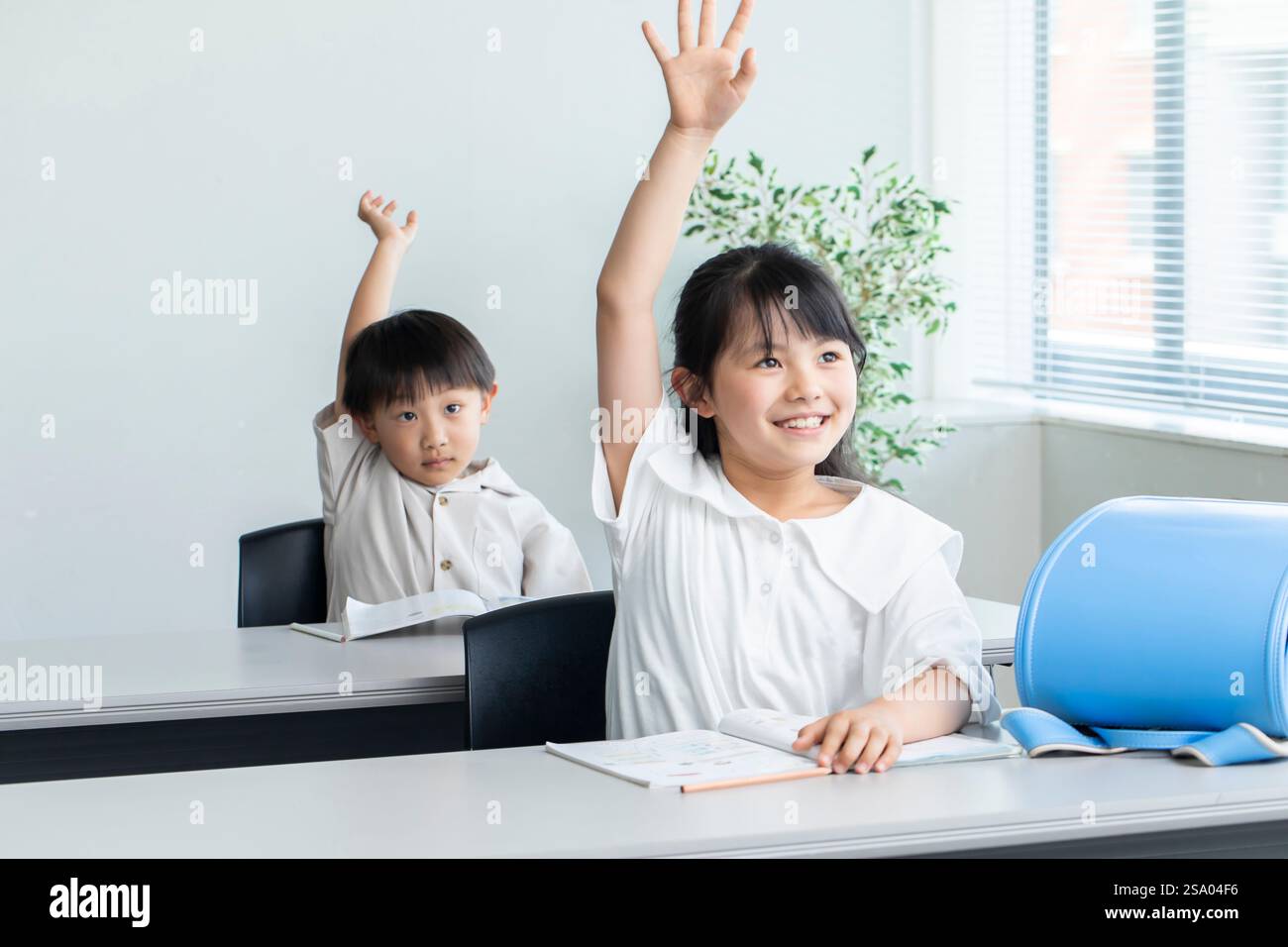 Female raise hand want to speak hi-res stock photography and images - Alamy