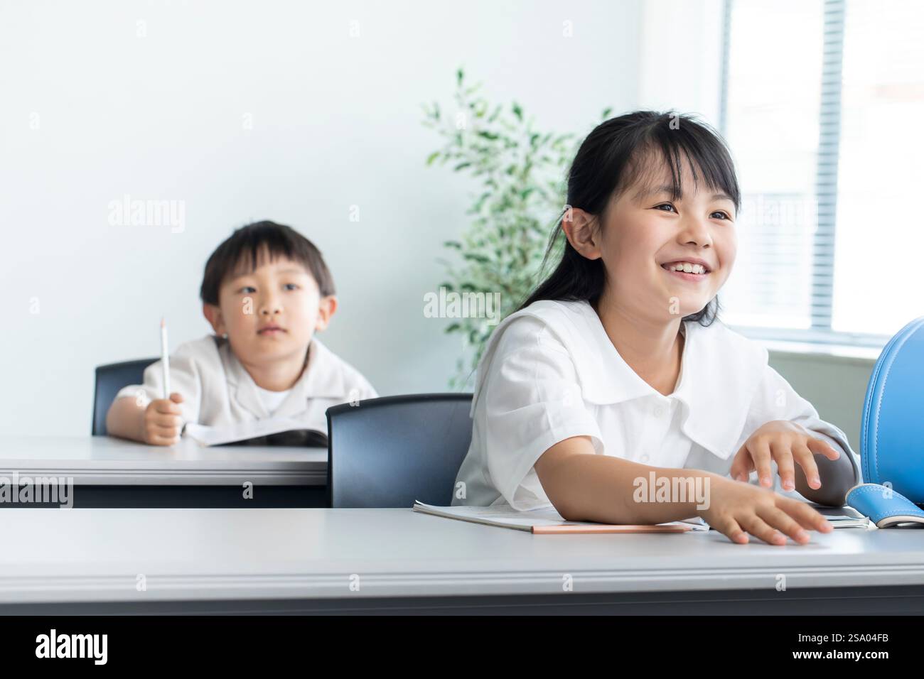 Child studying at cram school Stock Photo - Alamy
