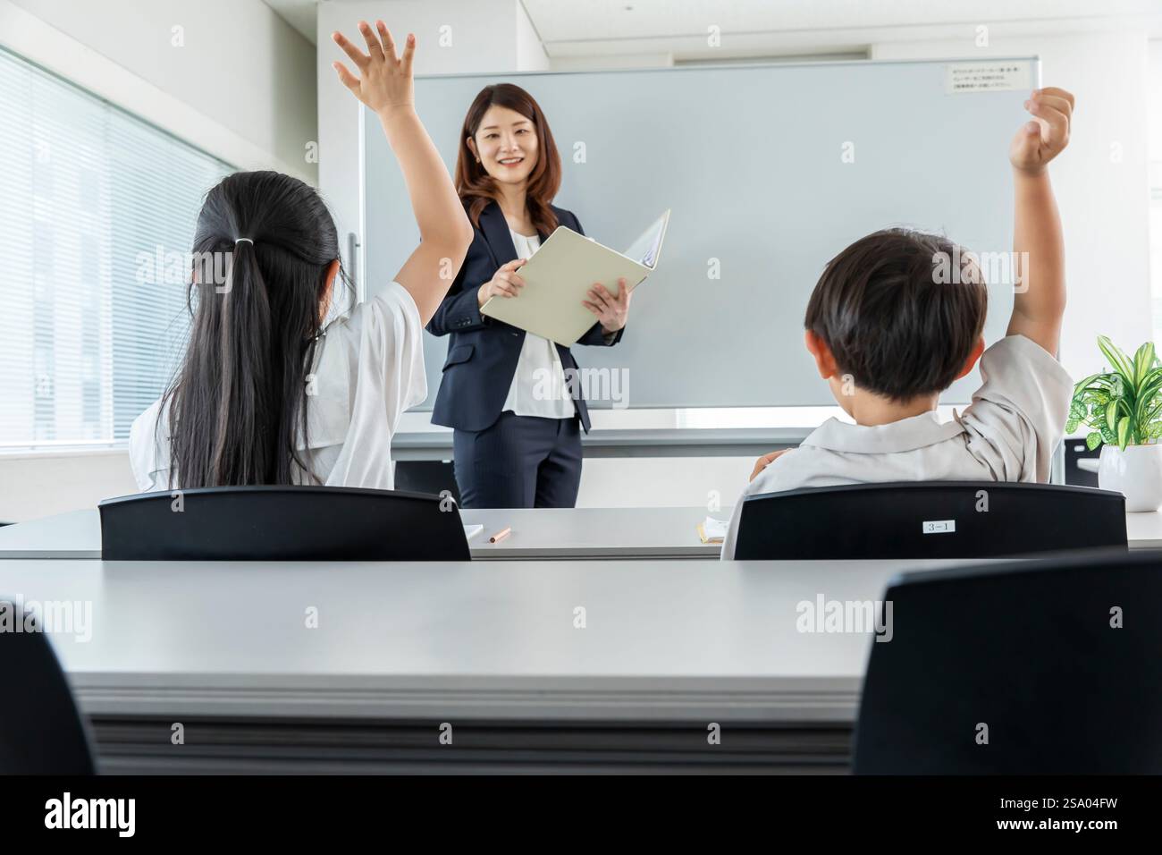 Primary schools student taking a class Stock Photo - Alamy