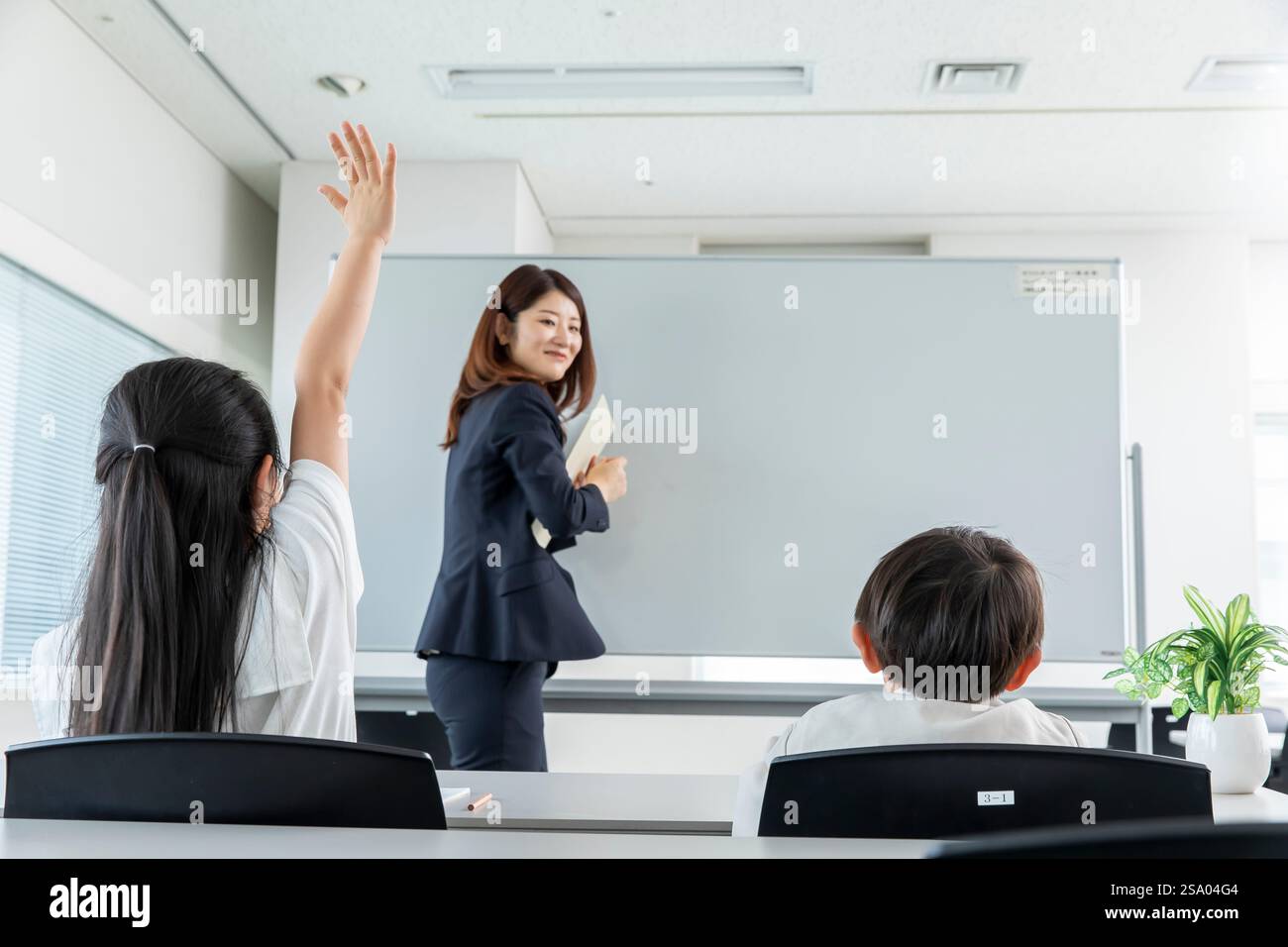 Primary schools student taking a class Stock Photo - Alamy