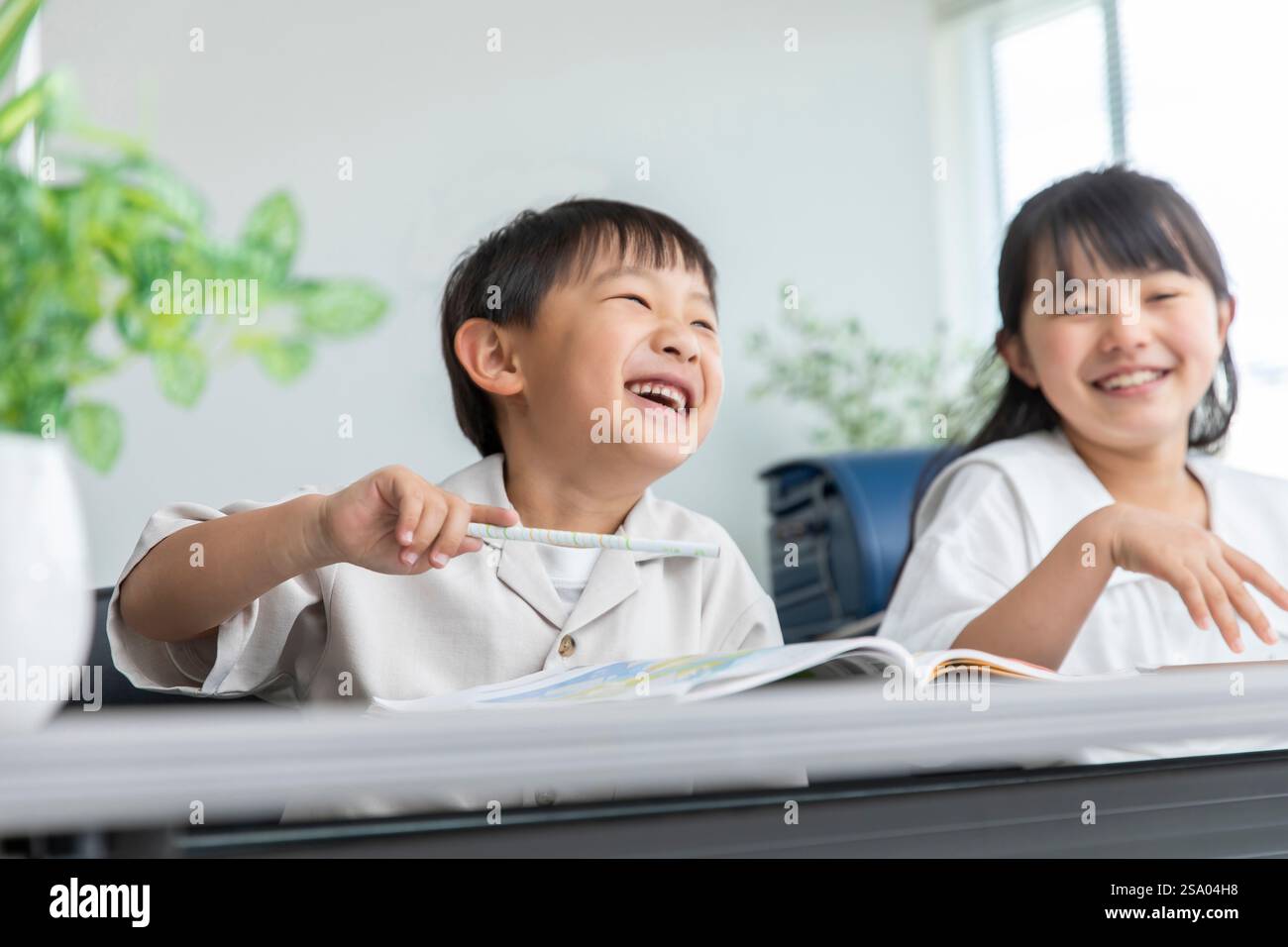 Primary schools student taking a class Stock Photo - Alamy