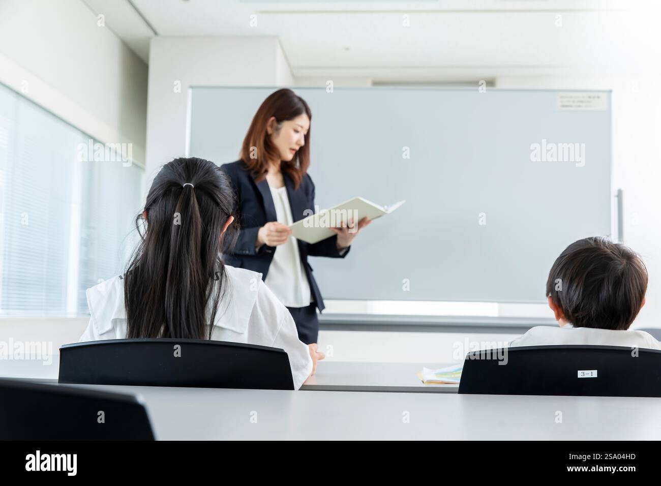 Primary schools student taking a class Stock Photo - Alamy