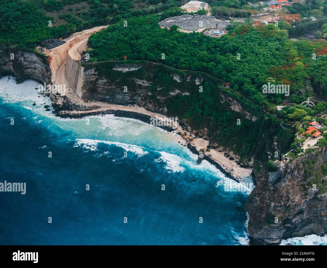 Engineering construction on rocky cliff under Uluwatu temple in Bali ...