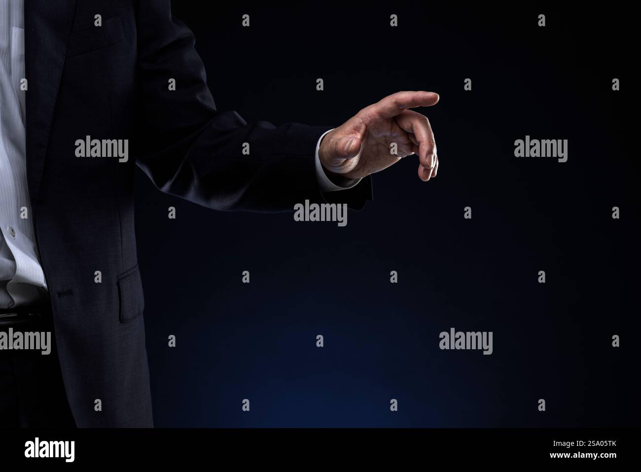 Mans hand in black suit hi-res stock photography and images - Alamy