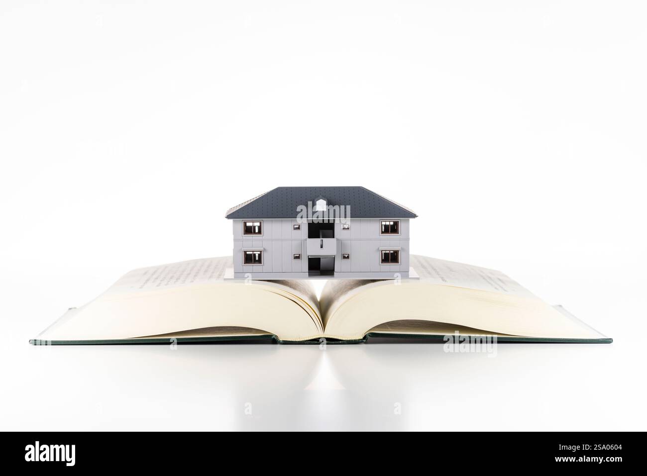 Open book and miniature flat Stock Photo - Alamy