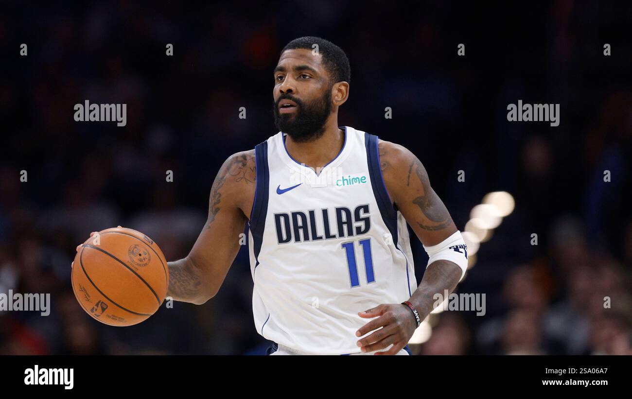 Dallas Mavericks guard Kyrie Irving dribbles during the first half of ...