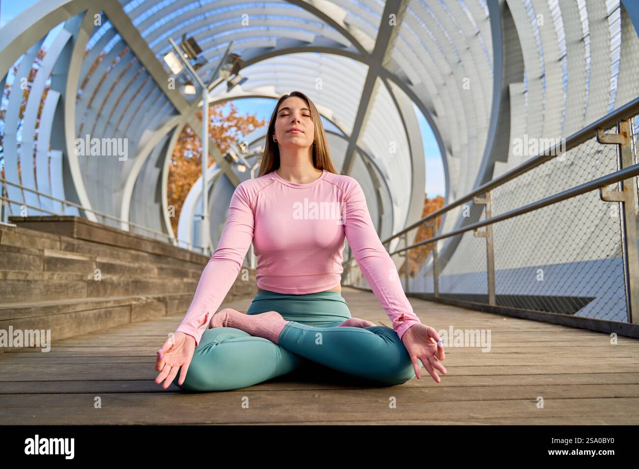 Serene woman meditating in lotus pose, enjoying a moment of mindfulness ...