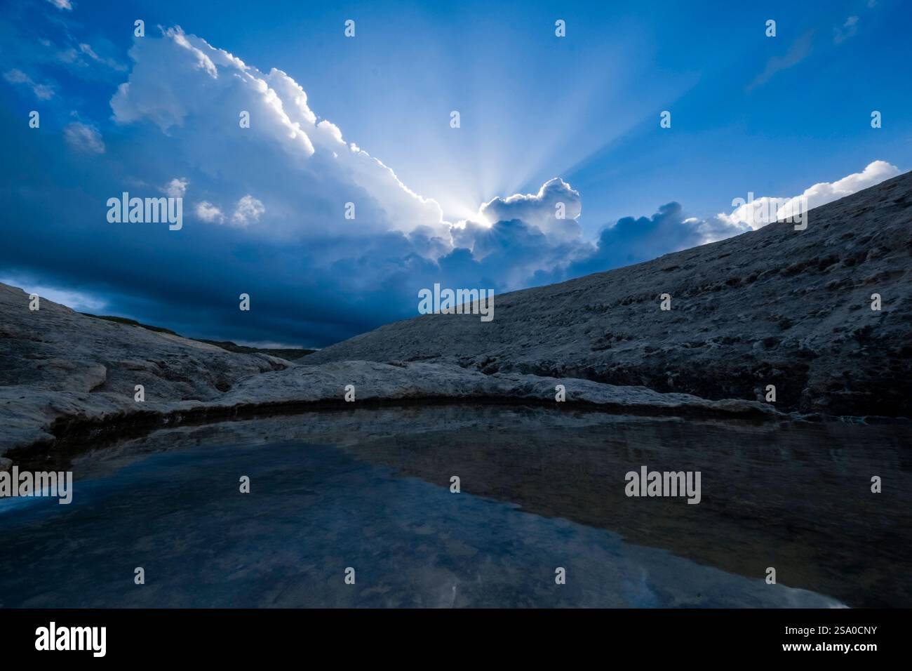 Rainwater in small water holes on the rocky coast around the Scoglio ...
