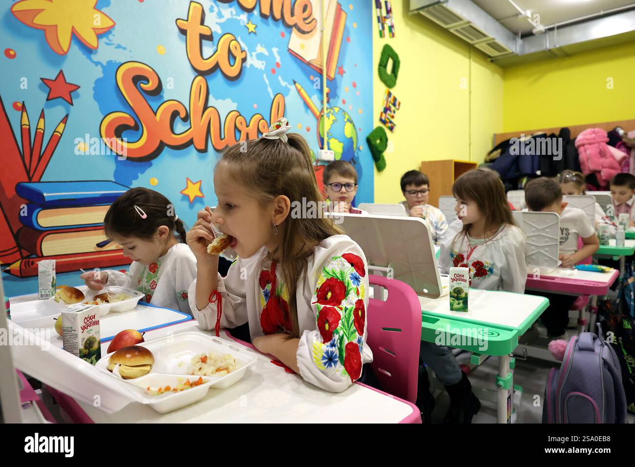 KHARKIV, UKRAINE - JANUARY 27, 2025 - Students eat in the classroom in ...