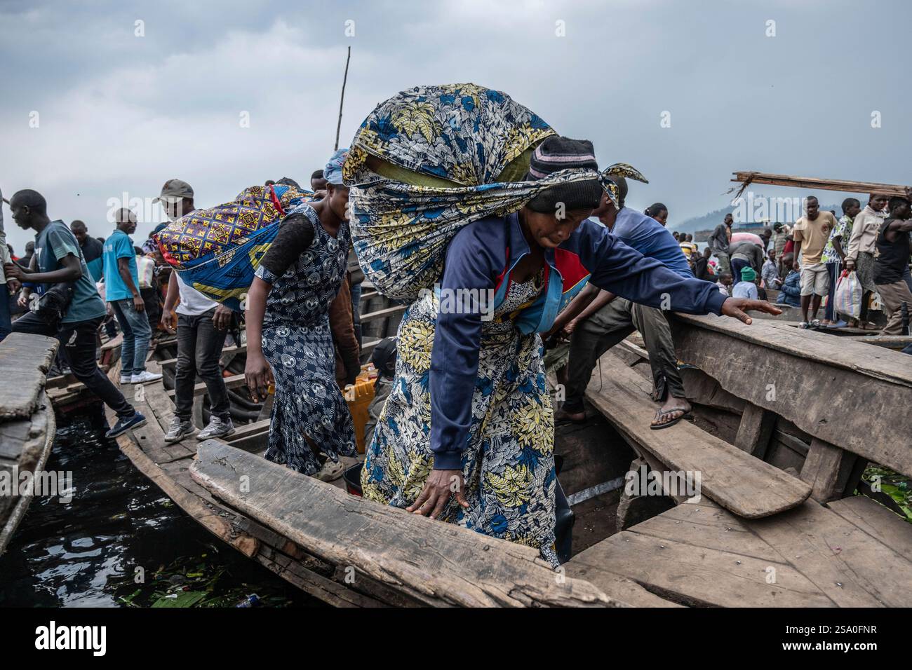 People fleeing M-23 rebel advances arrive by boat in Goma, Democratic Republic of the Congo ...