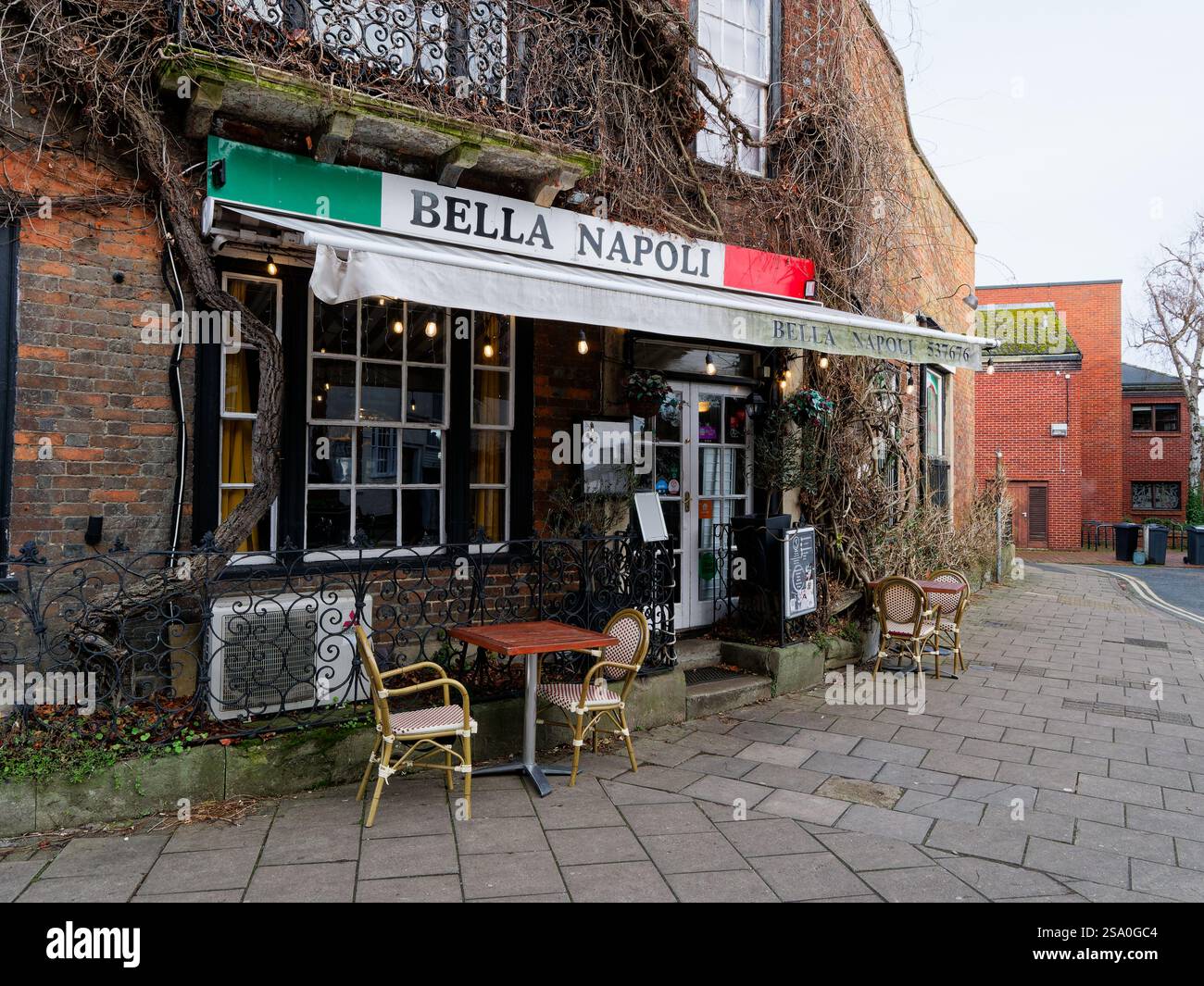 Bella Napoli Italian restaurant with outdoor seating and ivy-covered ...