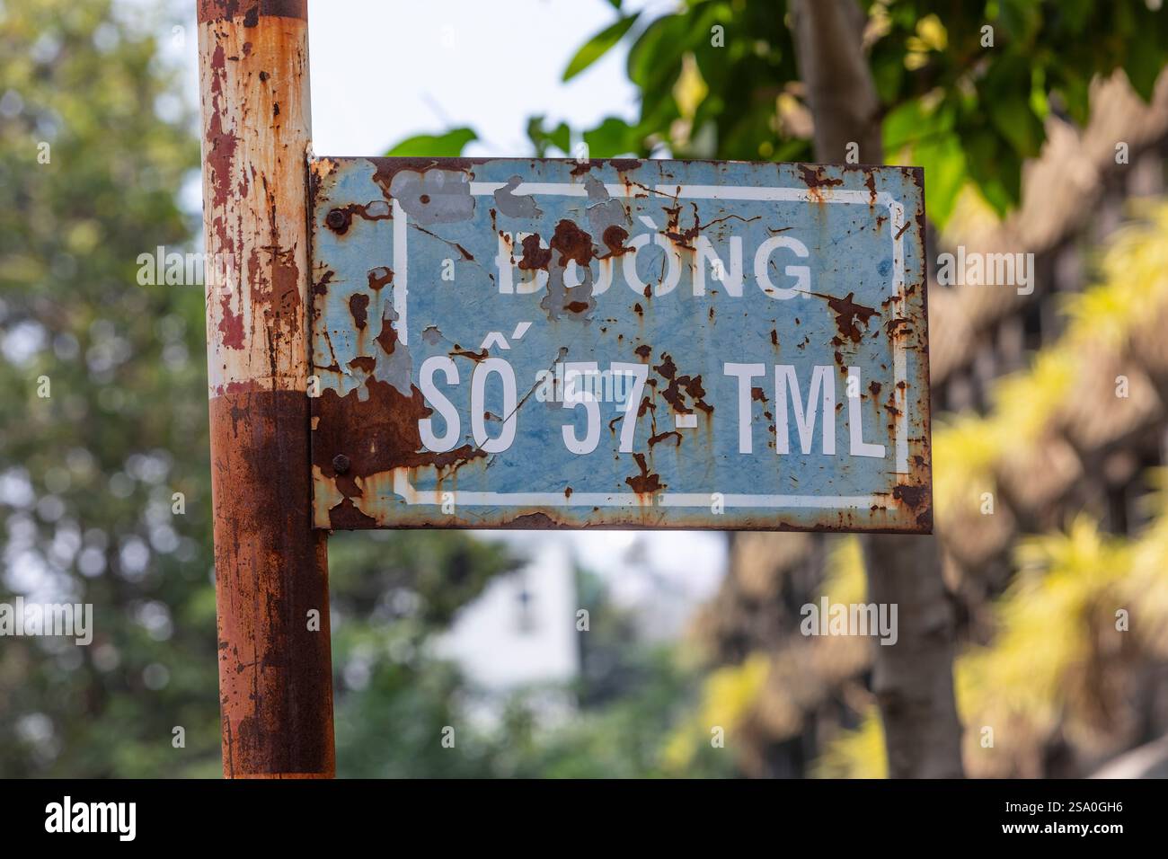 An old worn, rusting road sign in Ho Chi Minh City, Vietnam Stock Photo ...