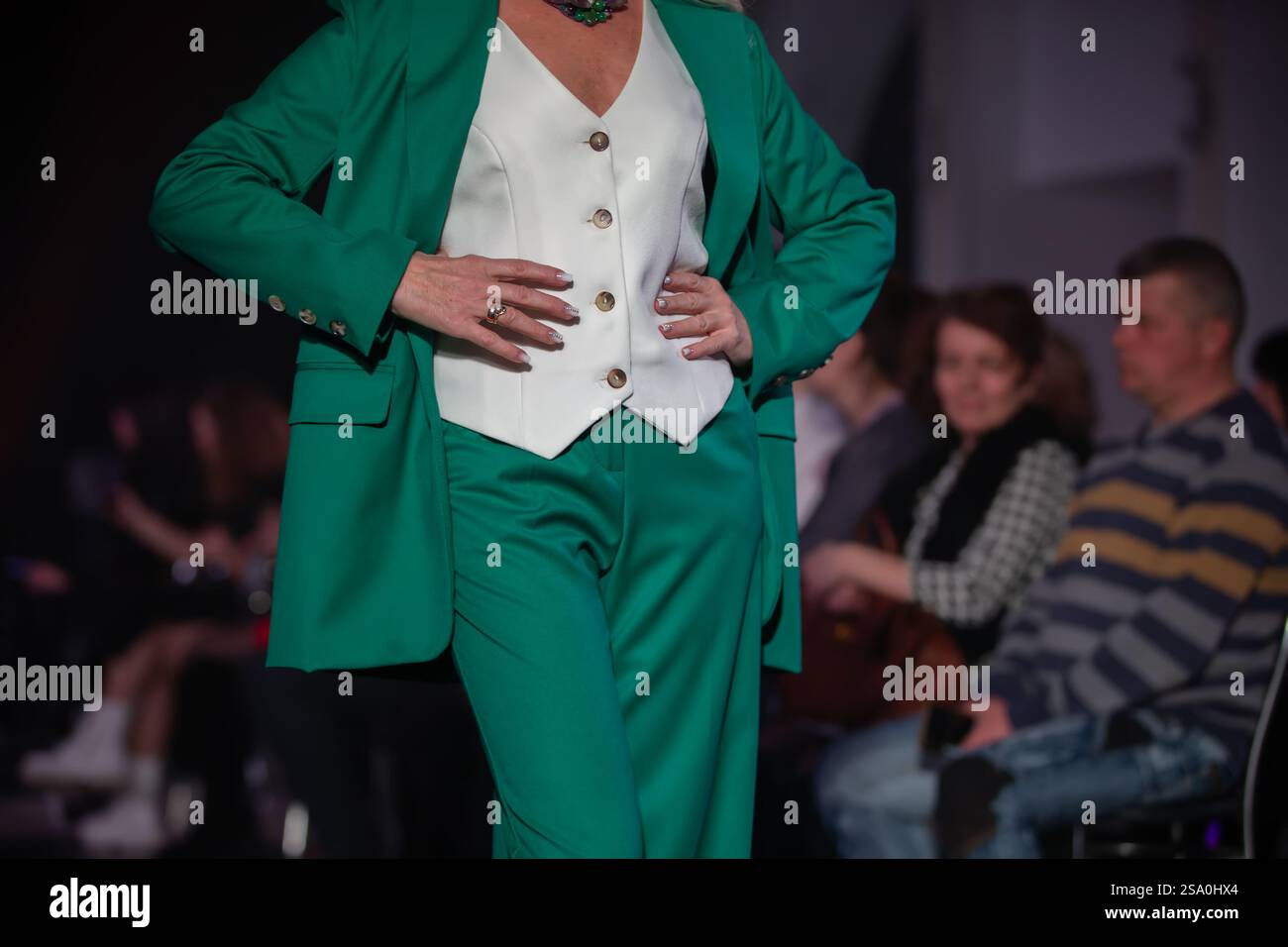 An unrecognizable female model shows off a costume on the catwalk Stock ...