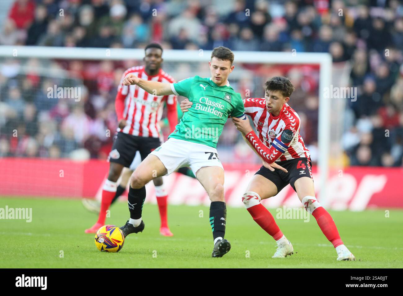 Adam Randell of Plymouth Argyle battles Dan Neil of Sunderland ...
