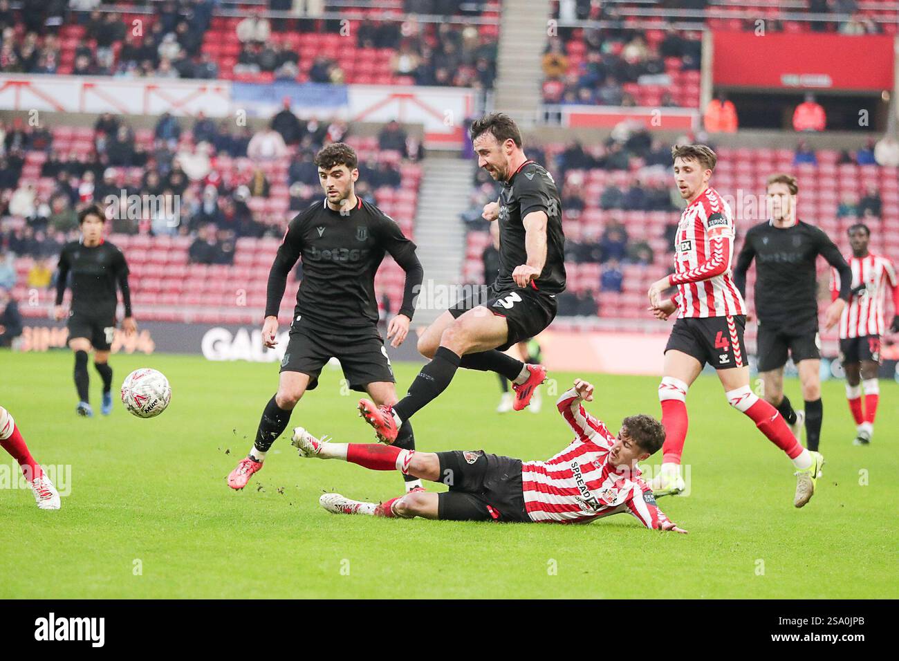 Trai Hume of Sunderland tackles Enda Stevens of Stoke City - Sunderland ...