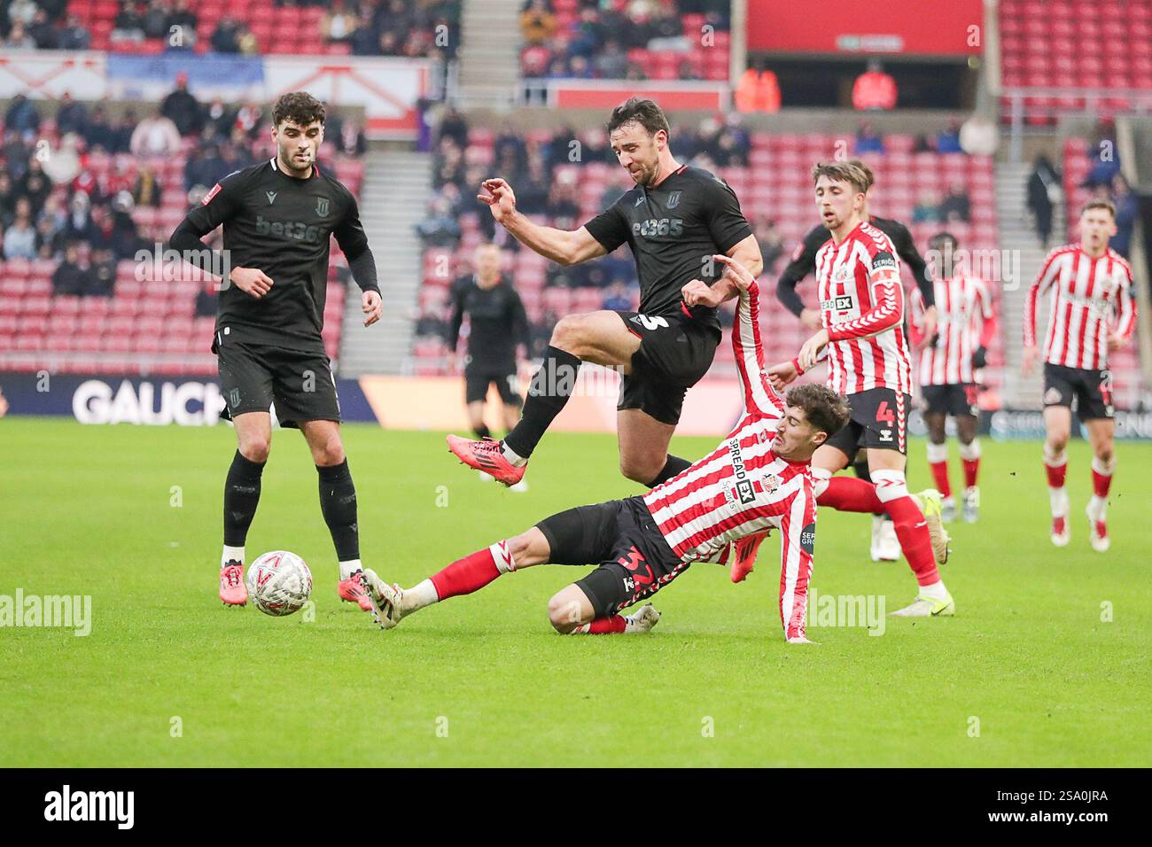 Trai Hume of Sunderland tackles Enda Stevens of Stoke City - Sunderland ...