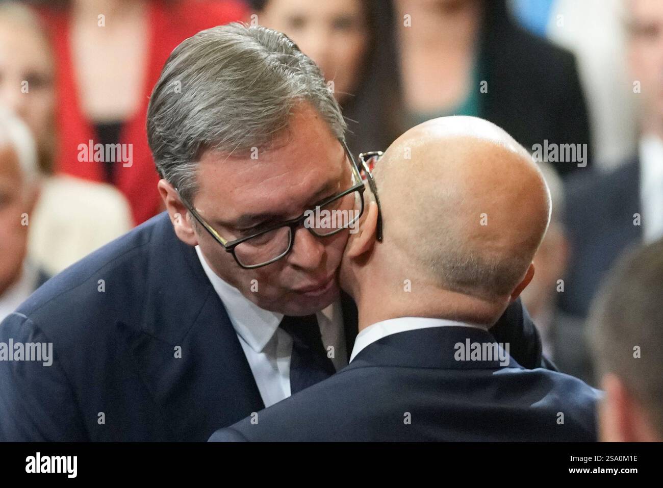 FILE - Serbian President Aleksandar Vucic, left, kisses Serbia's new ...