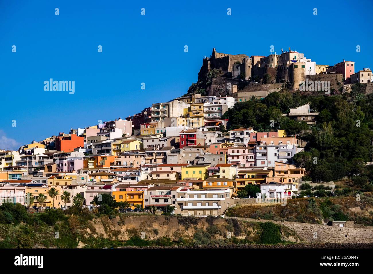 Houses in the coastal town of Castelsardo, grouped around a hill with ...
