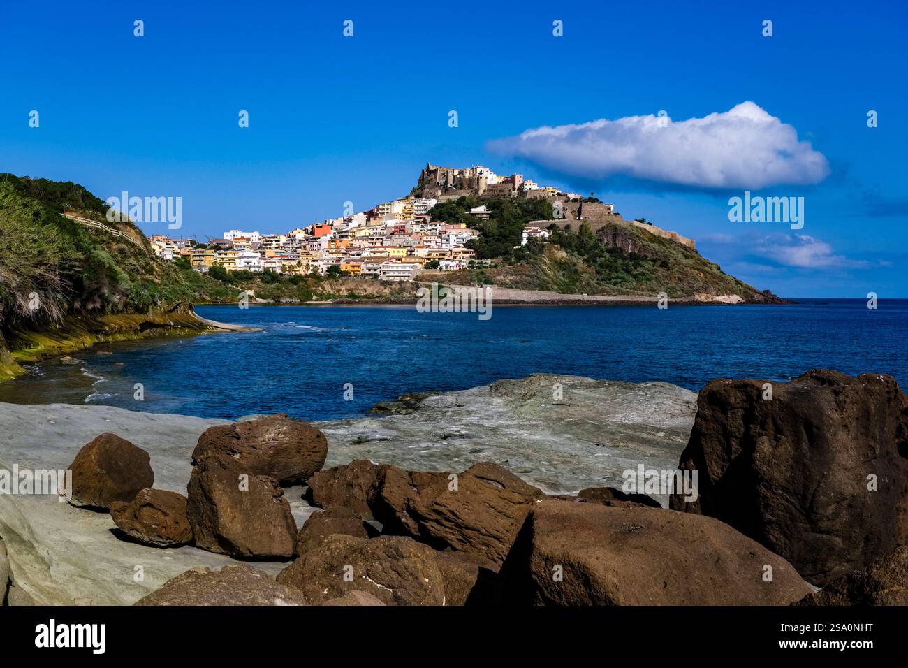 Houses in the coastal town of Castelsardo, grouped around a hill with ...