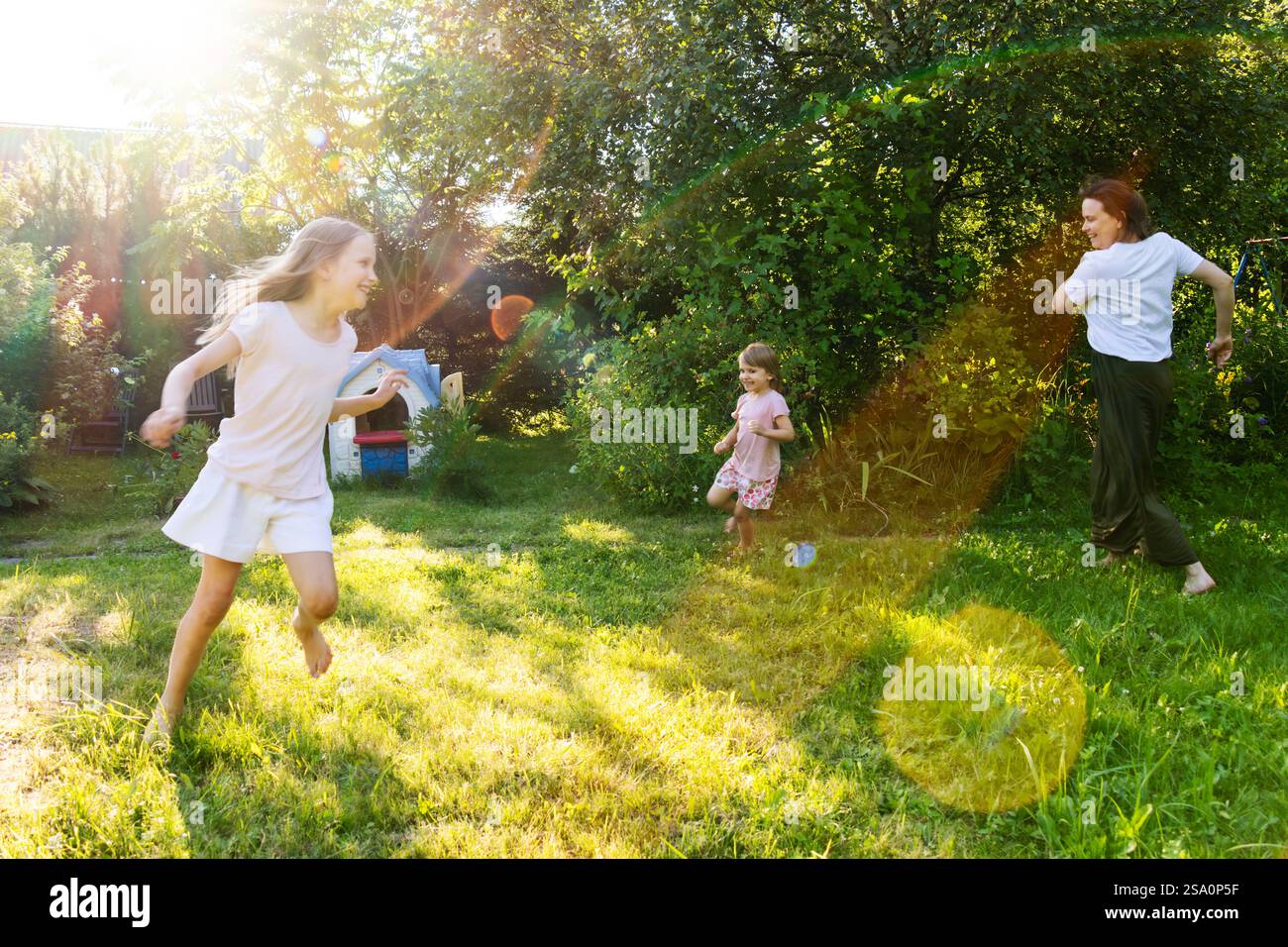 Two children run around playing hi-res stock photography and images - Alamy