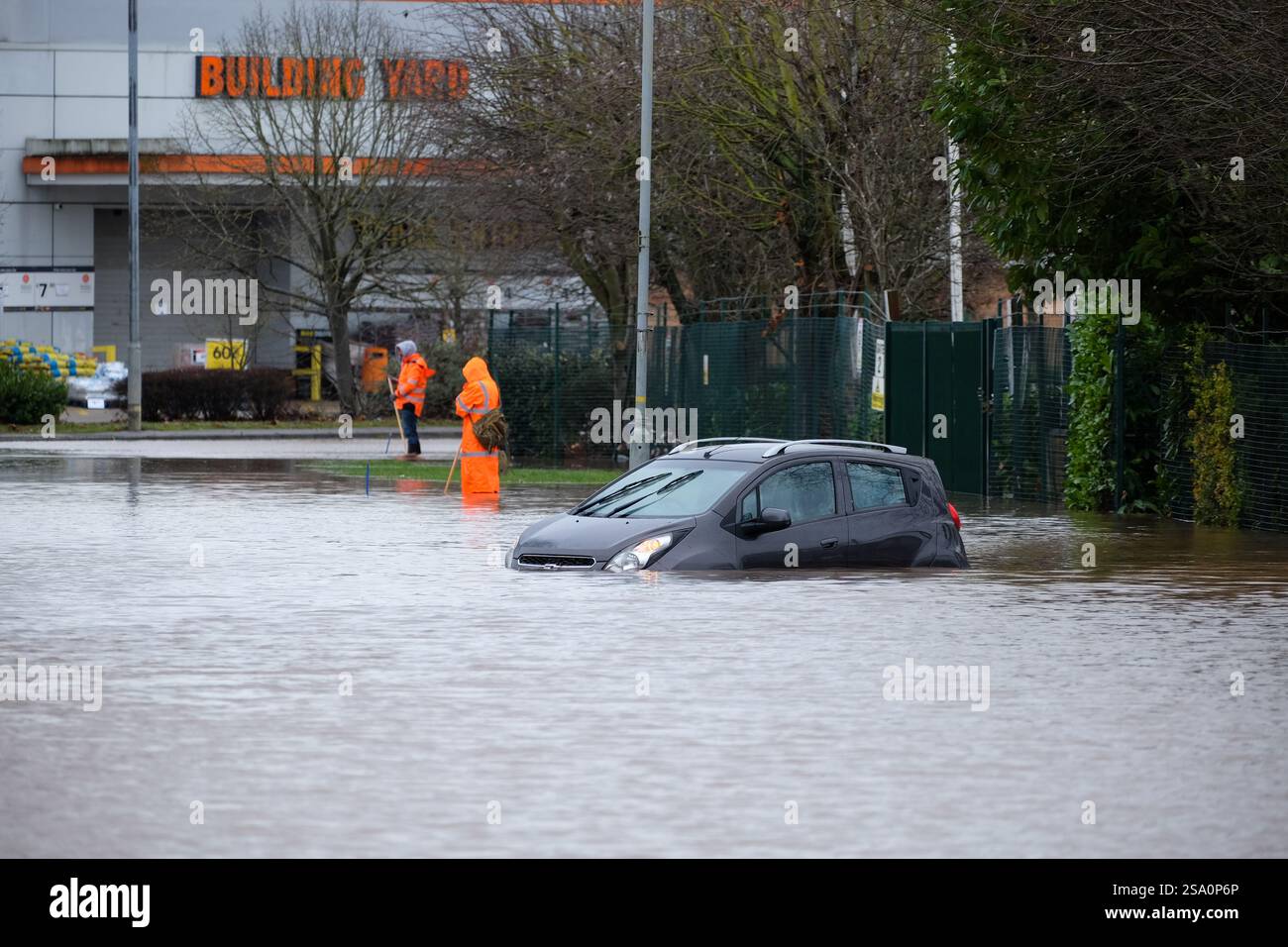 men wading through floodwater in loughbough Stock Photo - Alamy
