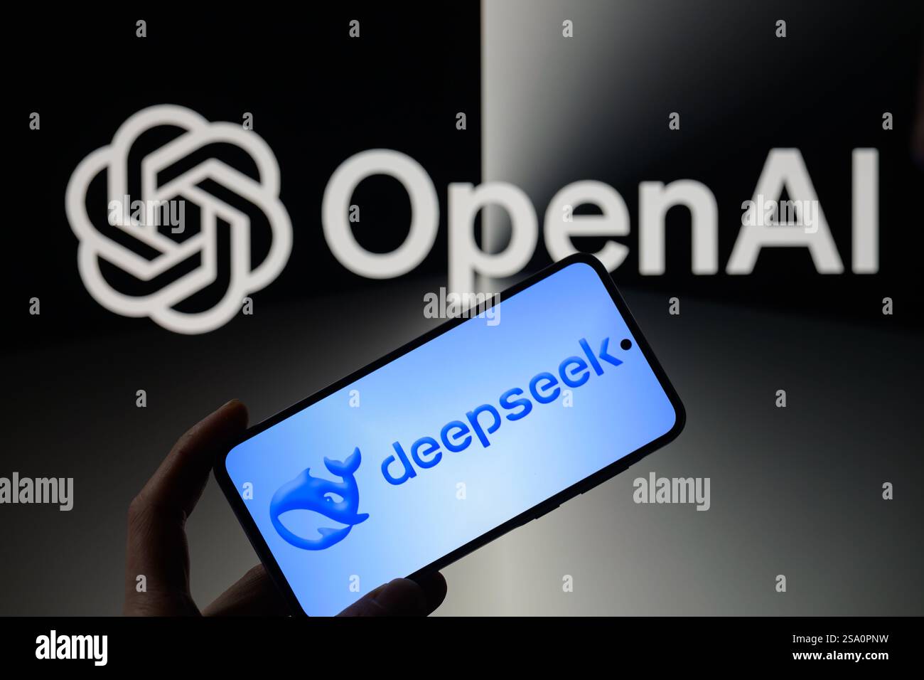 Deepseek logo is being displayed on a mobile phone, with openAI seen in ...
