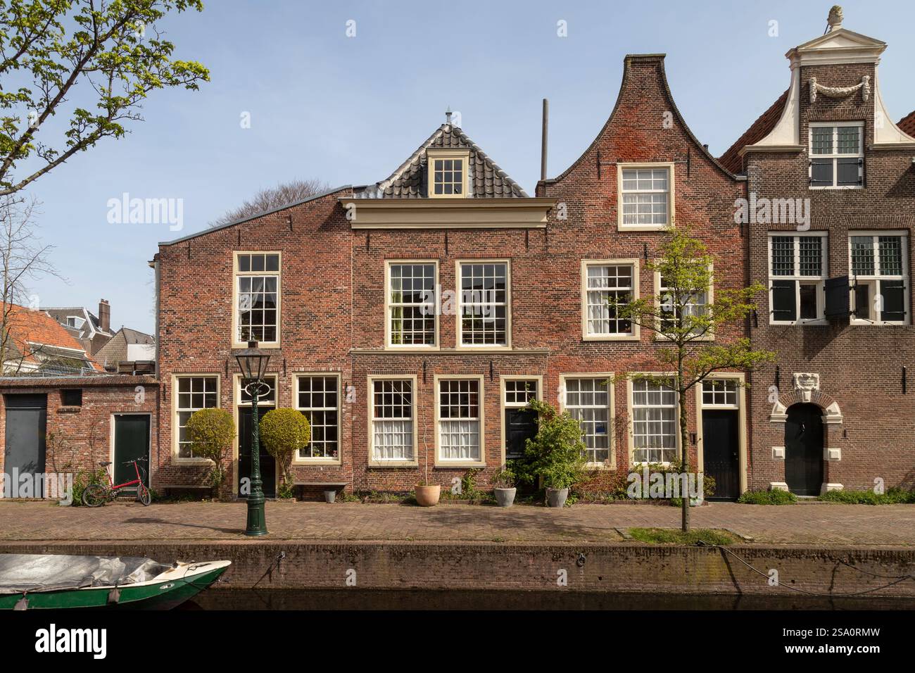 Historic canal houses in the center of the old Dutch city of Leiden ...