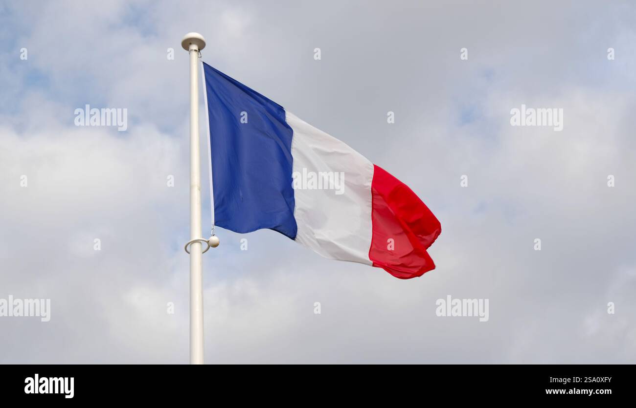 French national flag waving on cloudy sky background. The flag on a ...