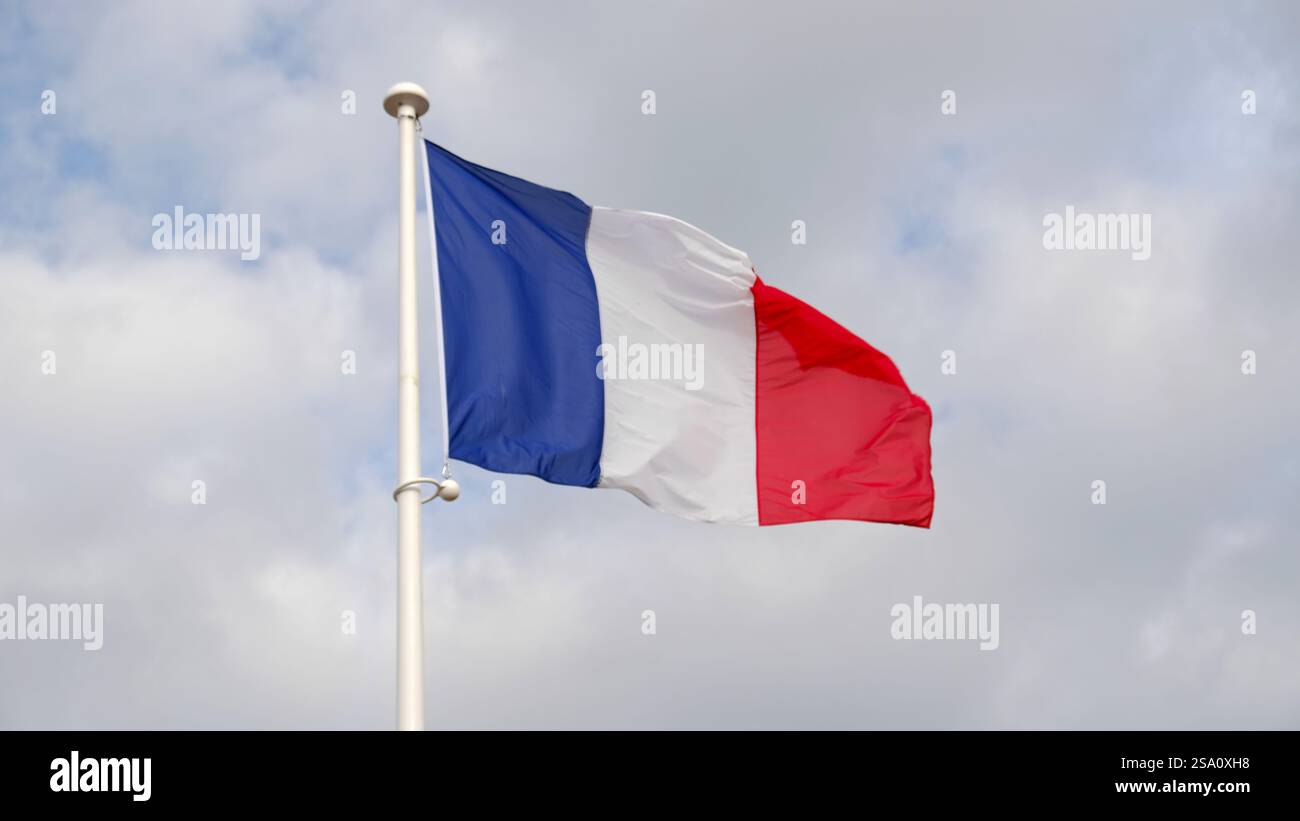 French national flag waving on cloudy sky background. The flag on a ...