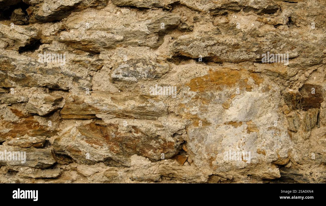 Texture of beige stone wall with rough masonry and uneven surface ...