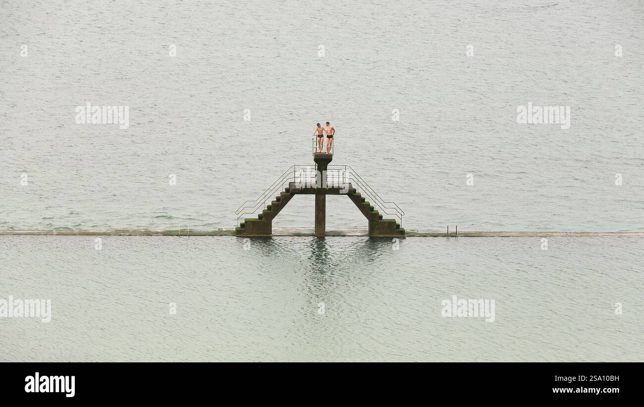 221 Young bathers on a high tide-hidden, seawater swimming pool ...
