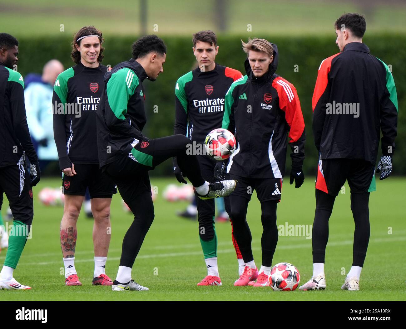 Arsenal's William Saliba (centre left) and Martin Odegaard (centre ...
