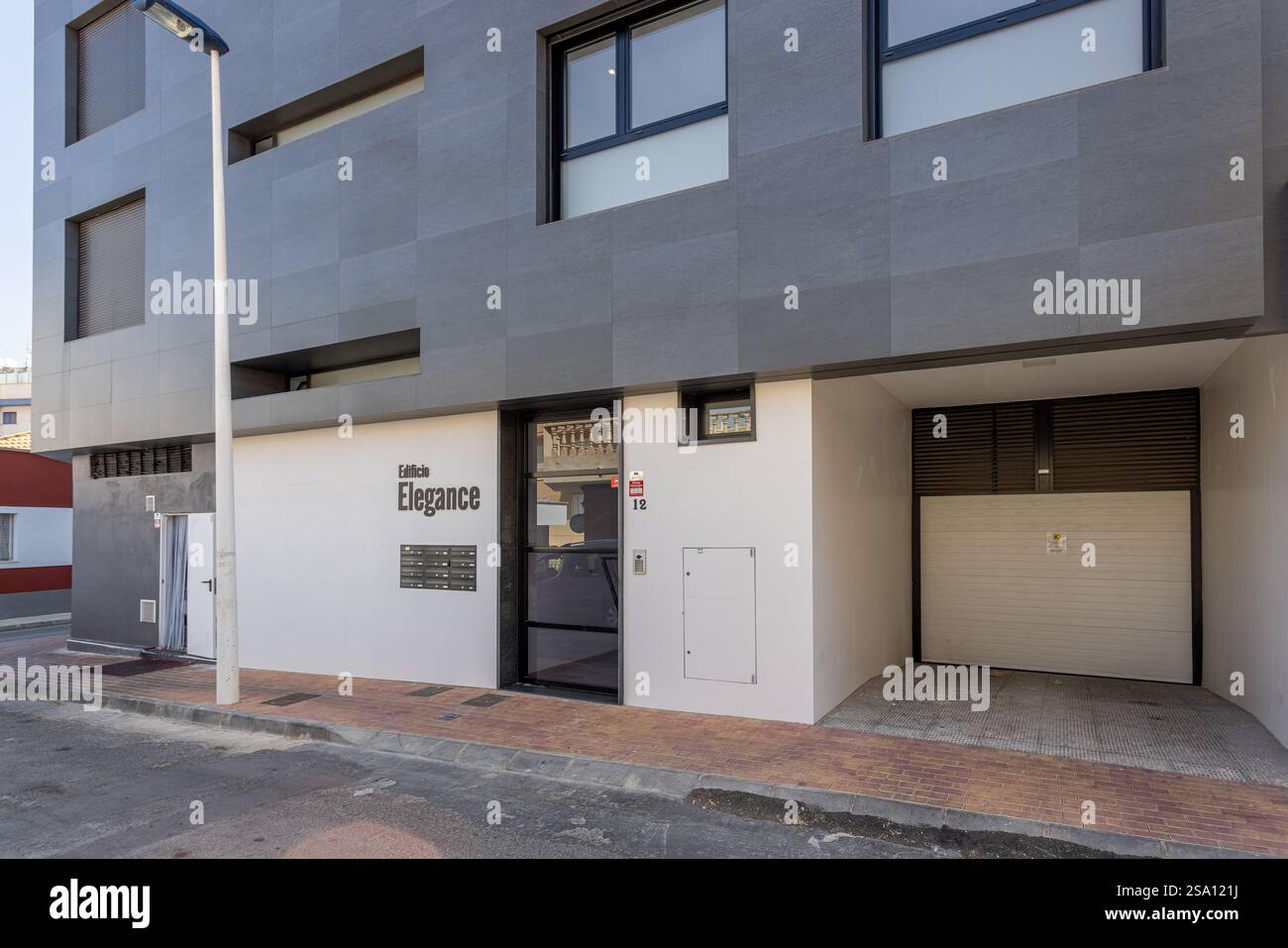 A contemporary apartment building exterior featuring a clean design ...