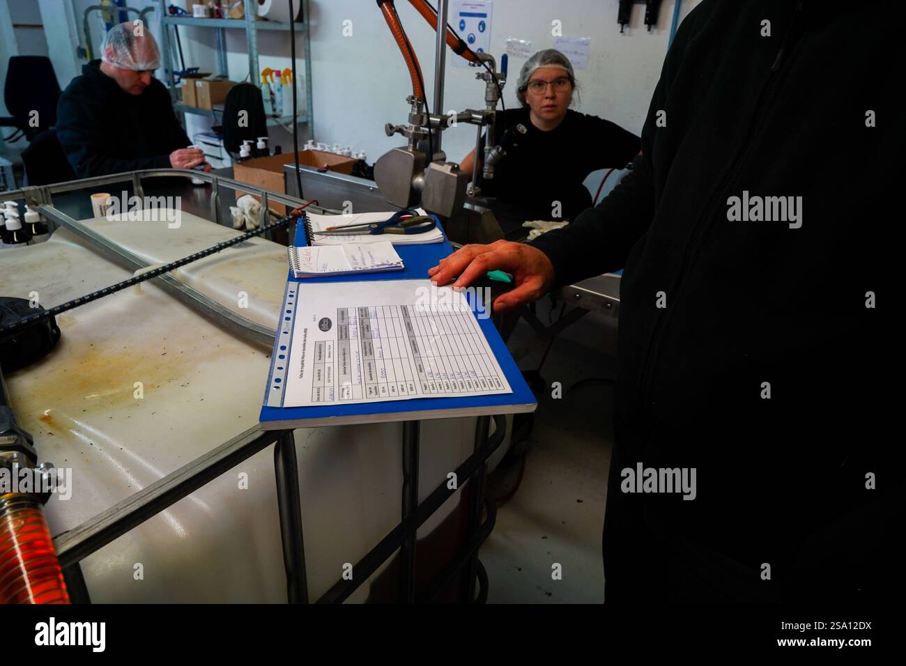 Disabled workers working in the shaping and packaging workshop. Quality ...