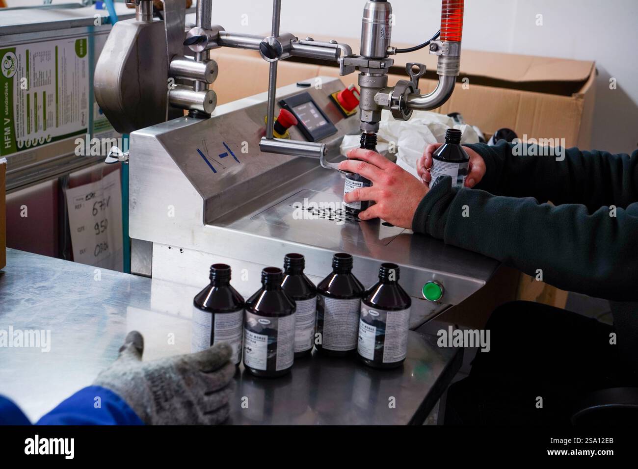 Disabled workers working in the shaping and packaging workshop. Filling ...