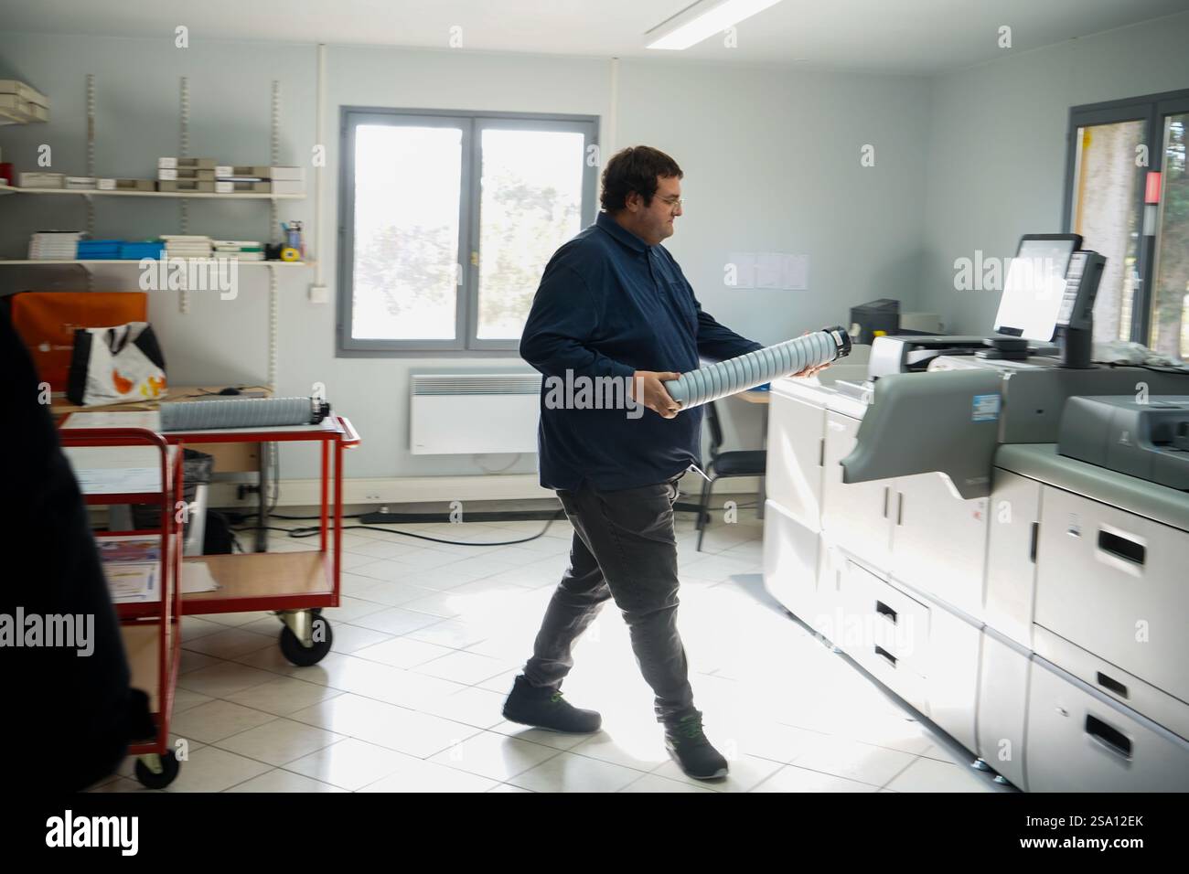 Disabled worker working in the printing, reprography and marking ...