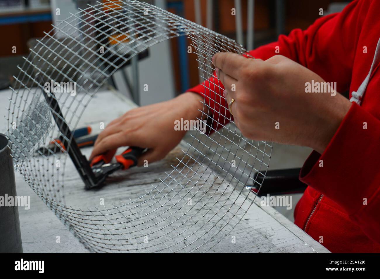 Disabled worker working in the shaping and packaging workshop. Shaping ...